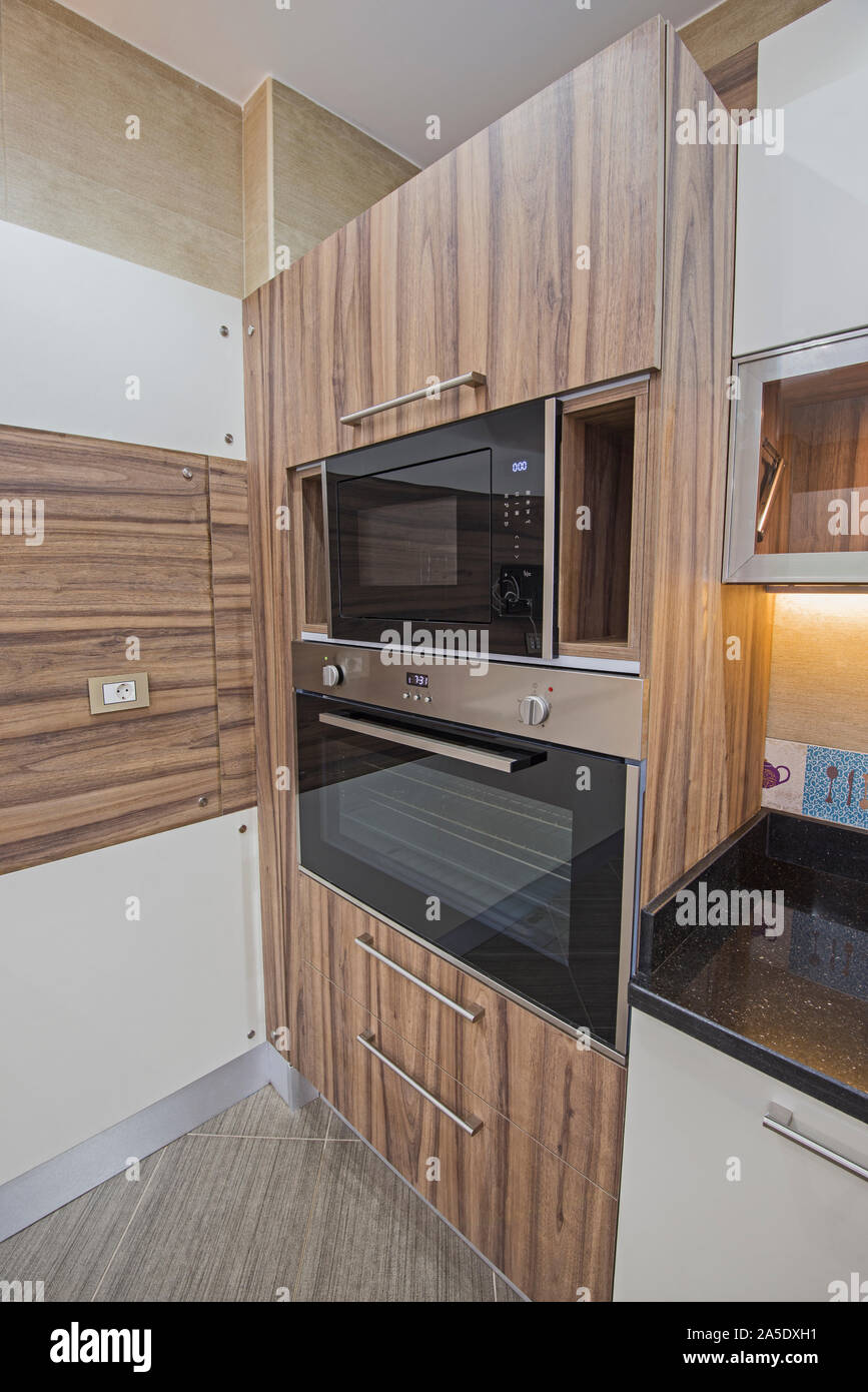 Interior design decor showing modern kitchen with cupboards and oven in ...