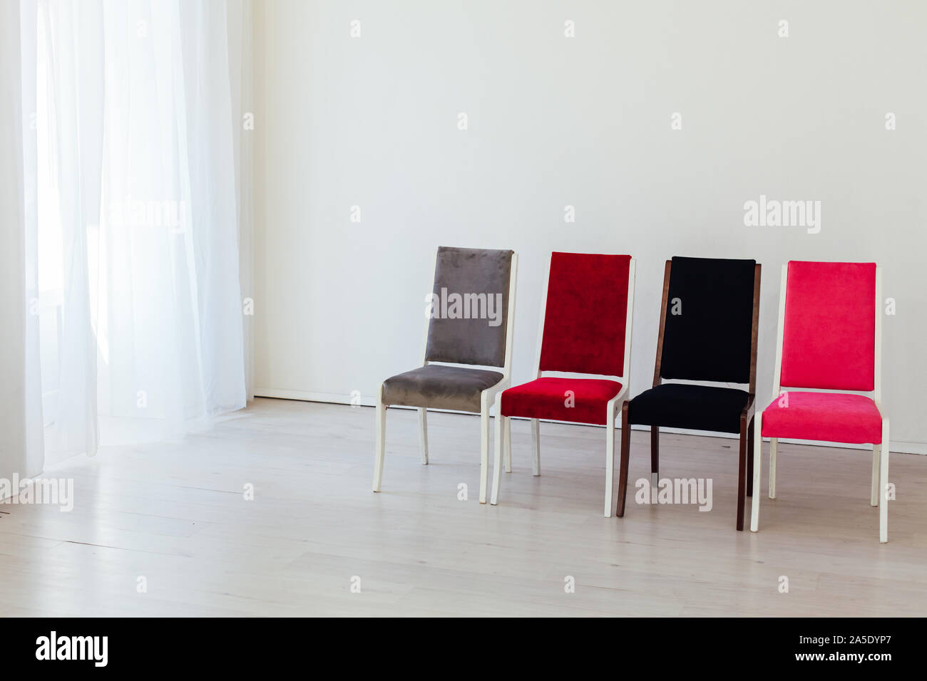 four chairs in the interior of an empty white room Stock Photo - Alamy