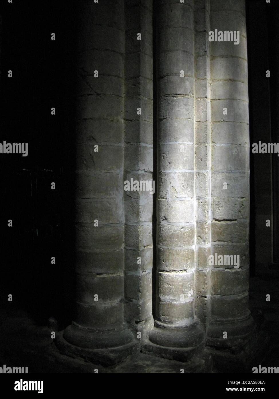 Vertical shot of light reflecting on columns Stock Photo - Alamy