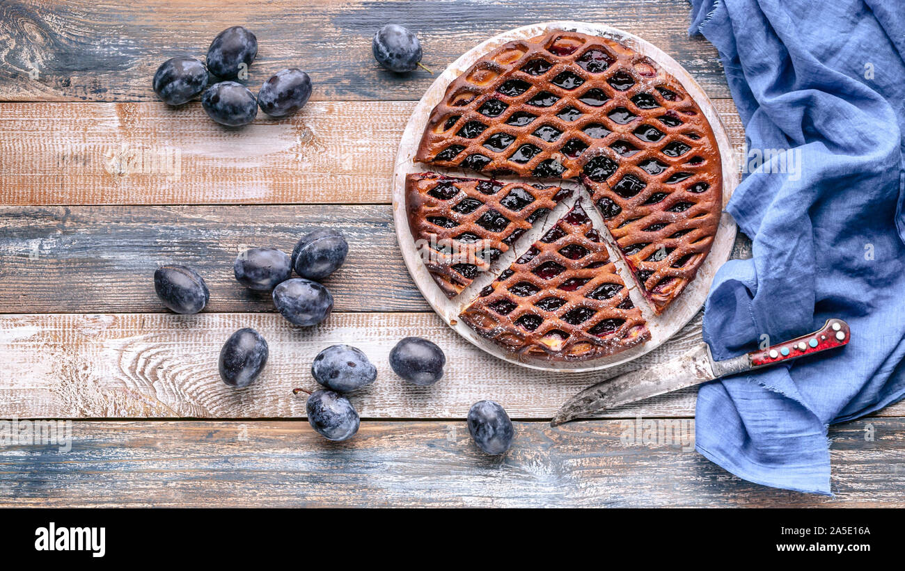 Food banner: Homemade delicious pie with prunes on a rustic background ...