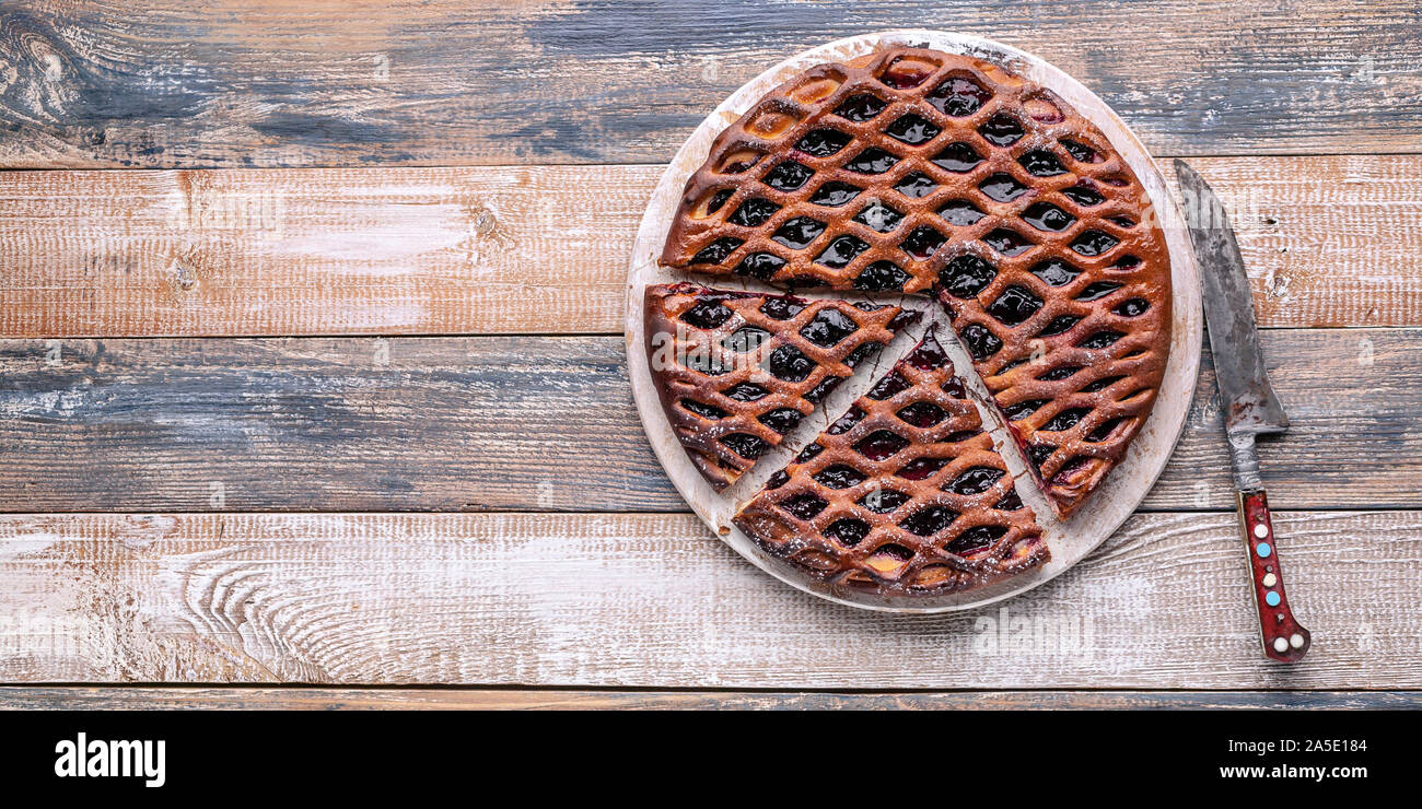 Food banner: homemade open pie with black currant on a rustic ...