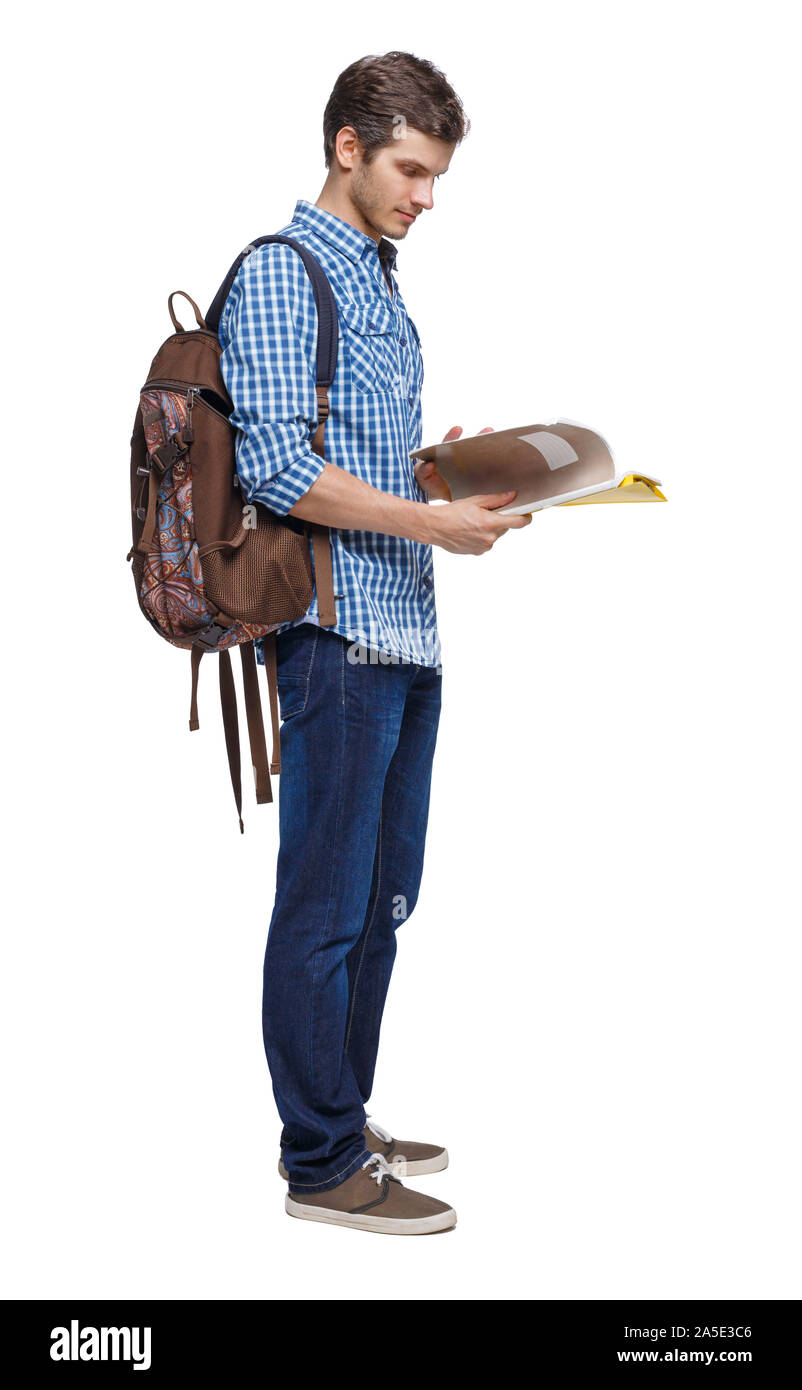 Side view of a student. guy with the backpack and textbooks. Rear view ...
