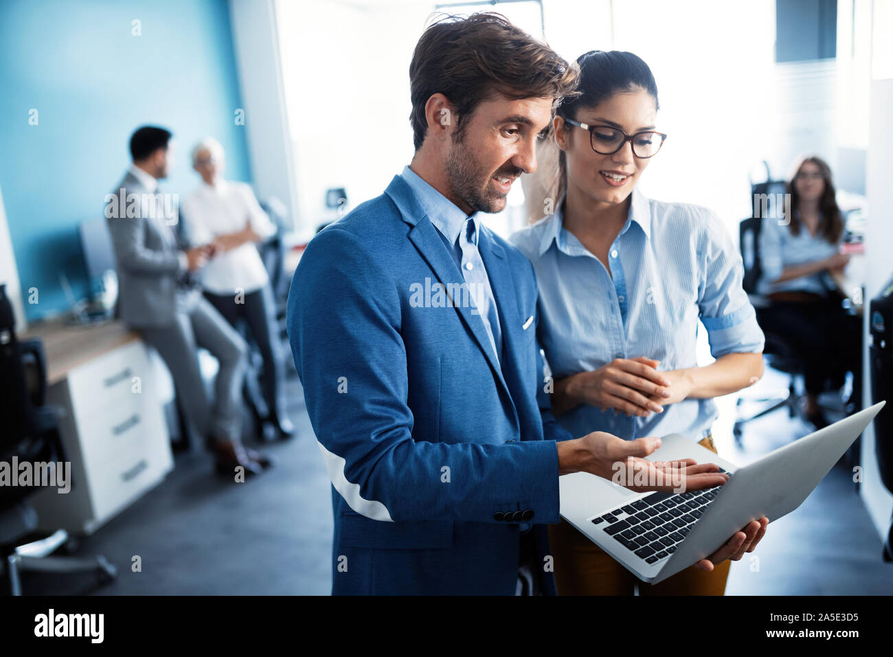 Programmer working in a software developing company office Stock Photo ...