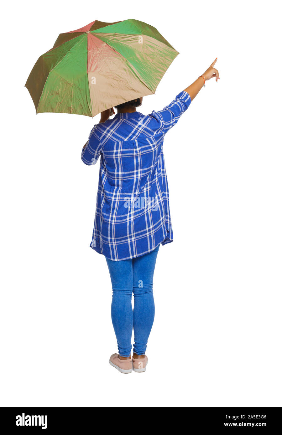 Back view of a black African-American woman under an umbrella points ...