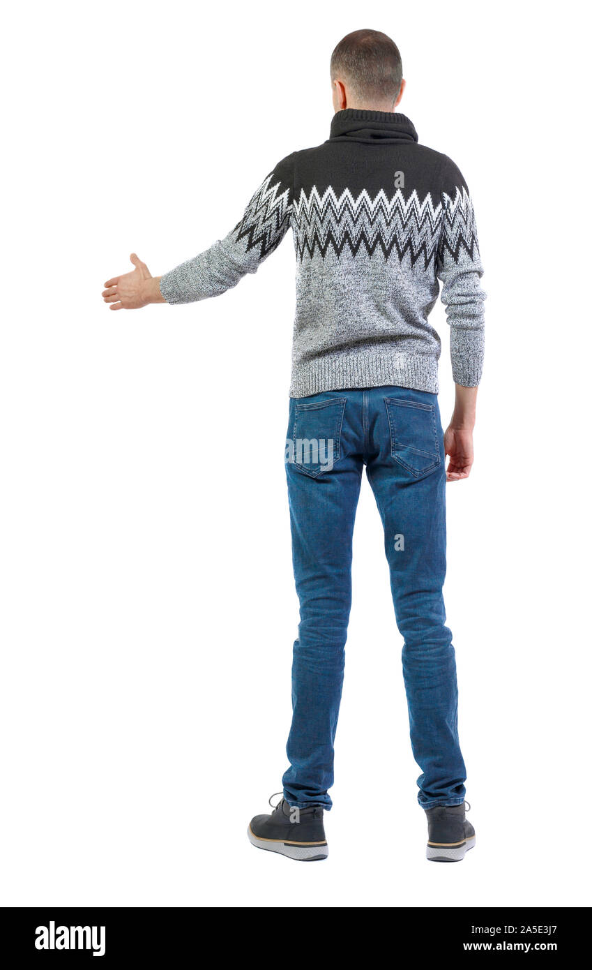 Back view of a man who stretches his hand for a handshake. Rear view ...