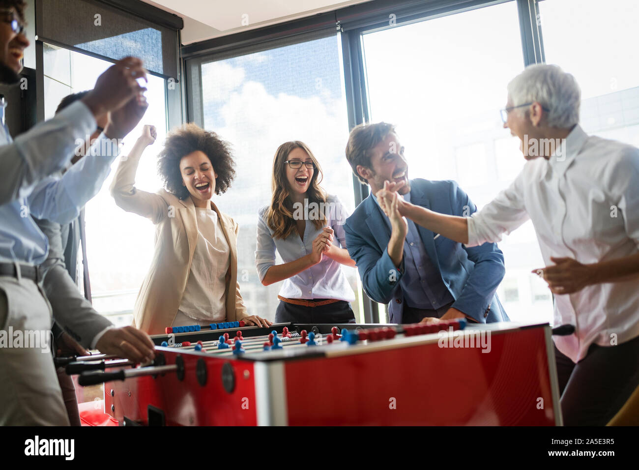 Employees playing table football hi-res stock photography and images ...