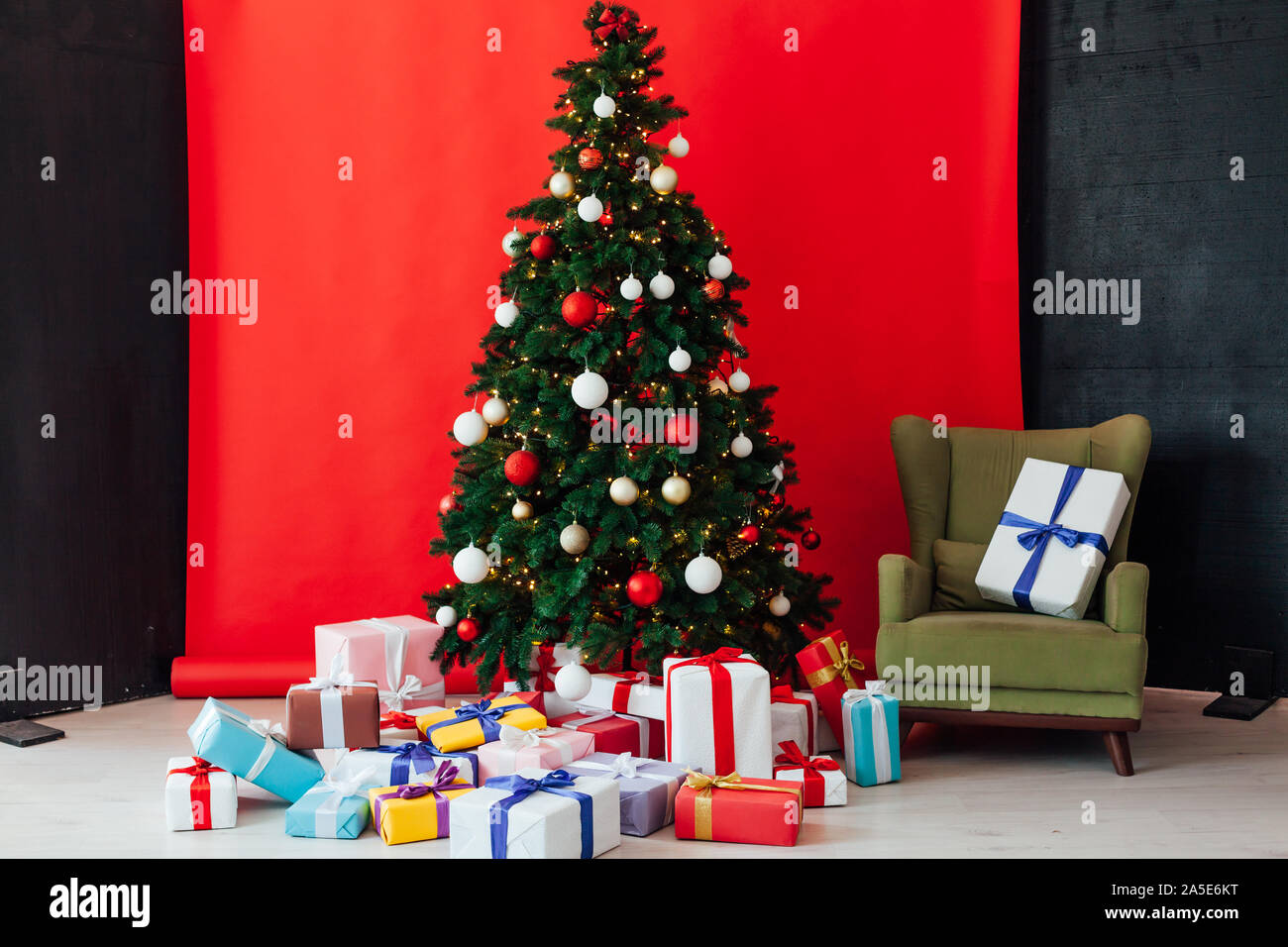 Christmas lights in the red room of new year Christmas tree gifts Stock ...