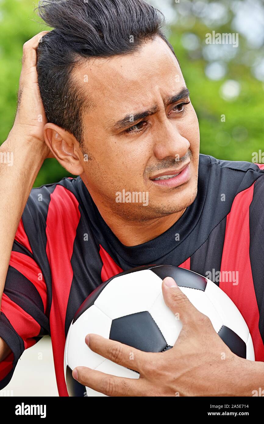 Confused Adult Male Soccer Player Stock Photo - Alamy