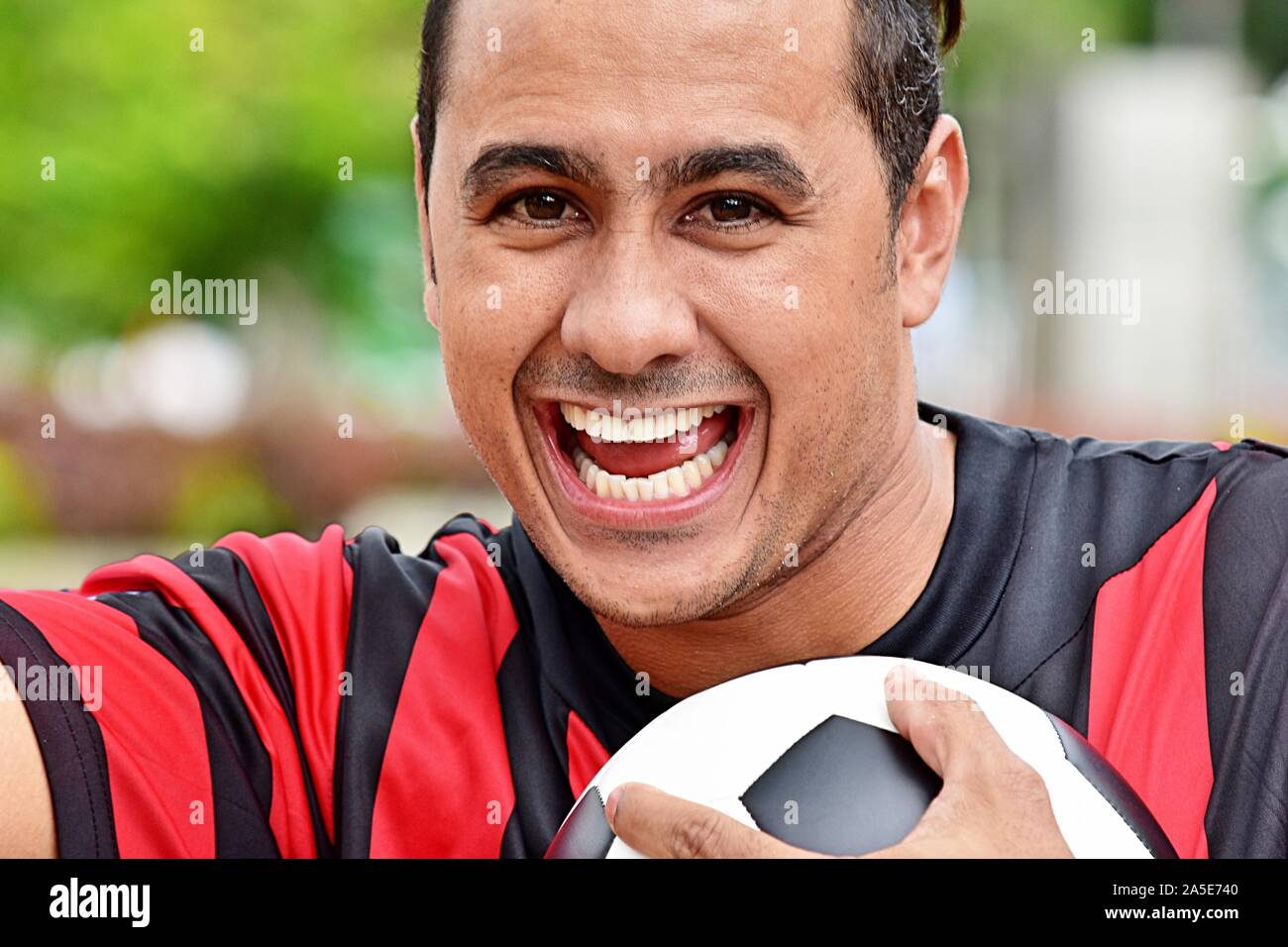 Laughing Adult Male Soccer Player And Winning Stock Photo - Alamy