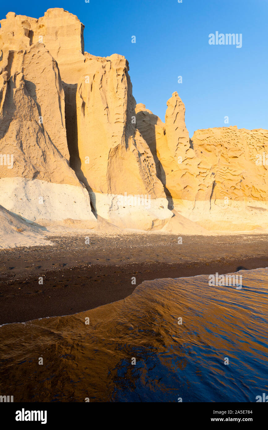 The long Vlychada Beach of Santorini with its impressive pumice cliffs ...