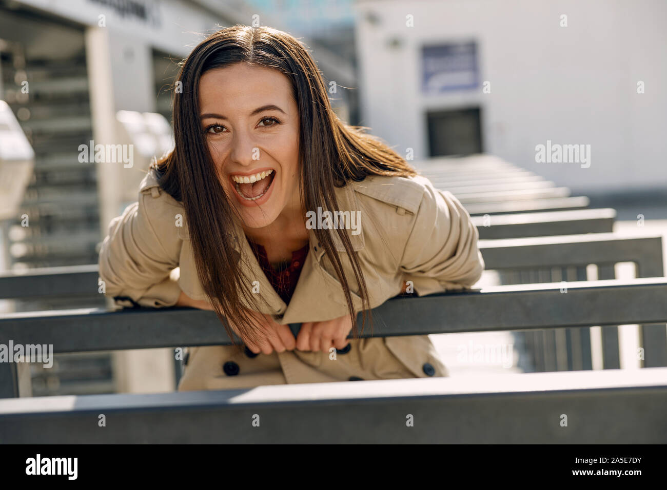 Feeling happiness. Delighted girl demonstrating her emotions while ...