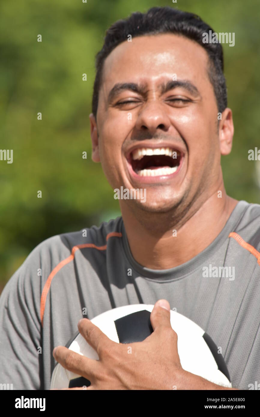 Laughing Adult Male Soccer Player Stock Photo - Alamy