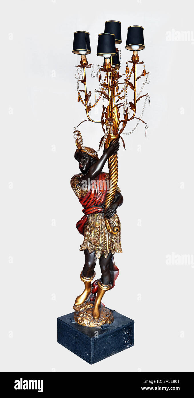 African Colonial lamp with black man holding a light lamp isolated ...