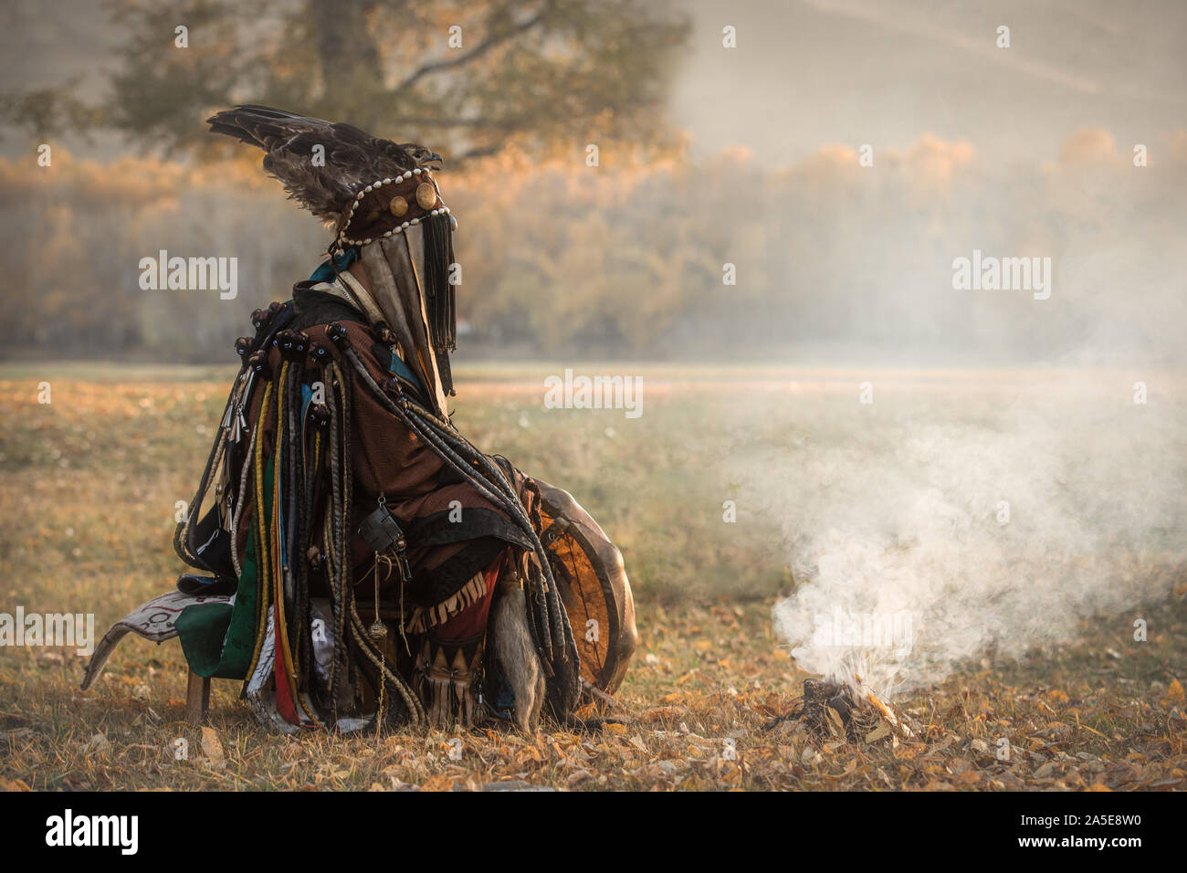 Mongolian traditional shaman performing a traditional shamanistic ...