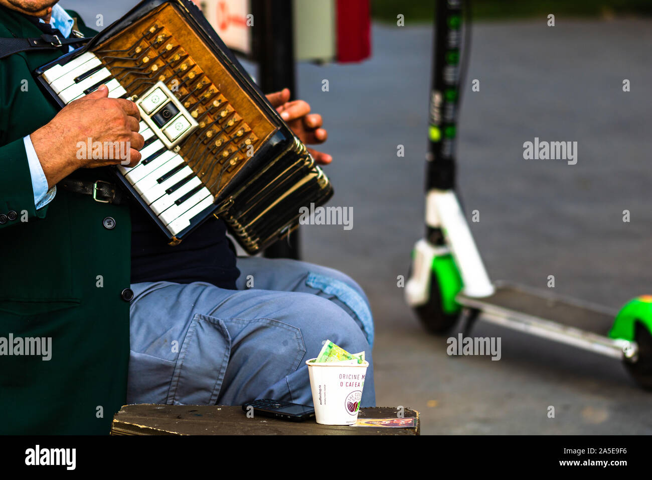 Local old man playing bandoneon (accordion) on the street in Bucharest ...