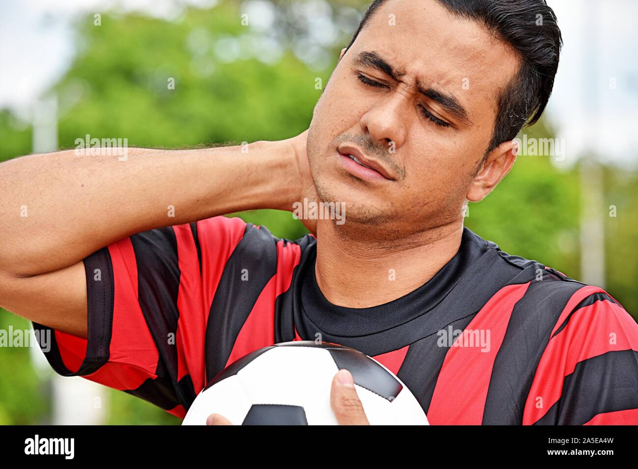 Sore Or Stressed Adult Male Soccer Player Stock Photo - Alamy