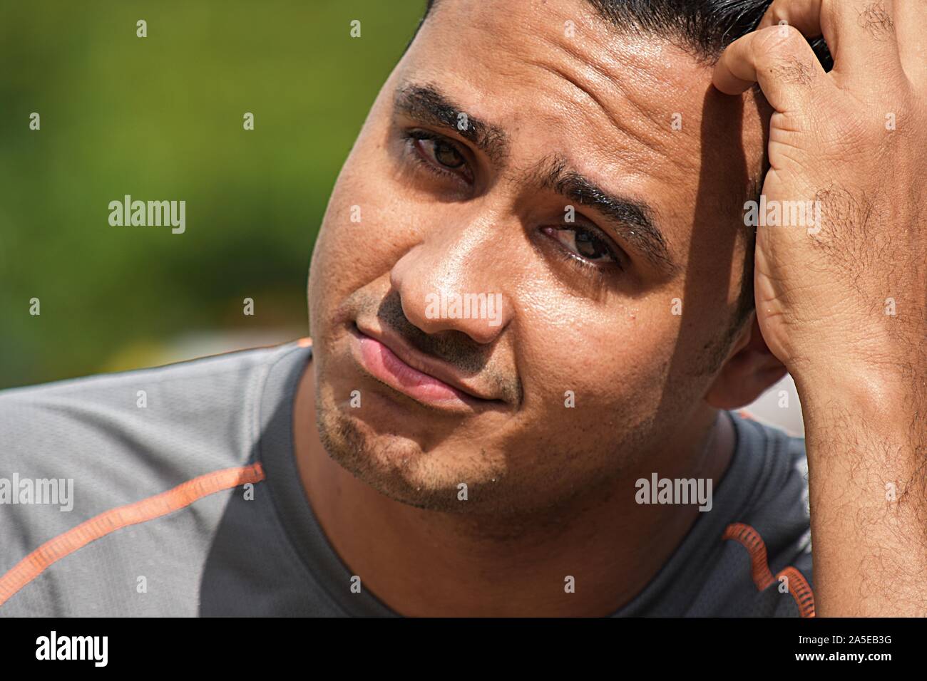 Confused Male Athlete Stock Photo - Alamy