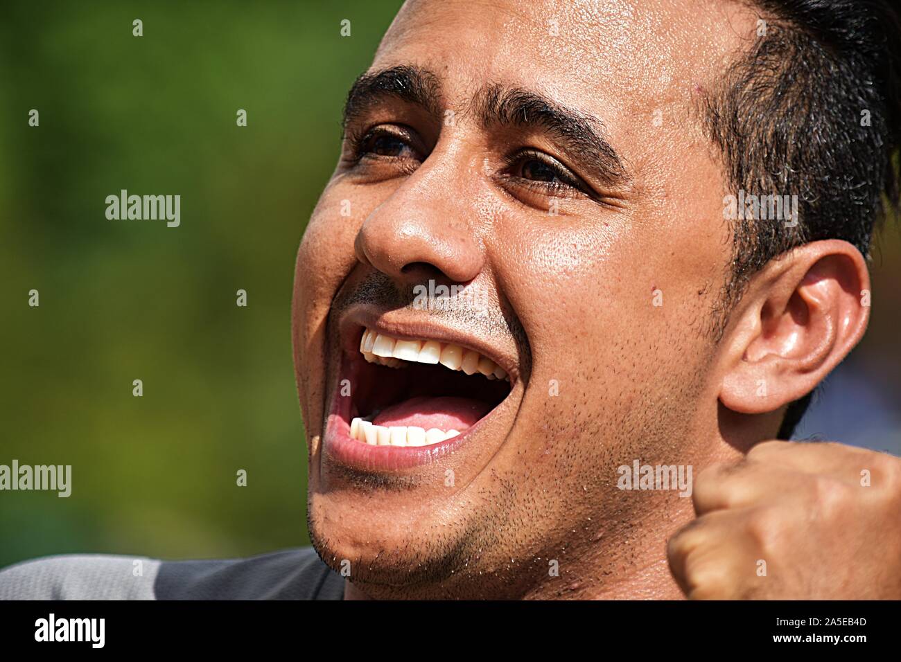 Excited Adult Hispanic Male And Winning Stock Photo - Alamy