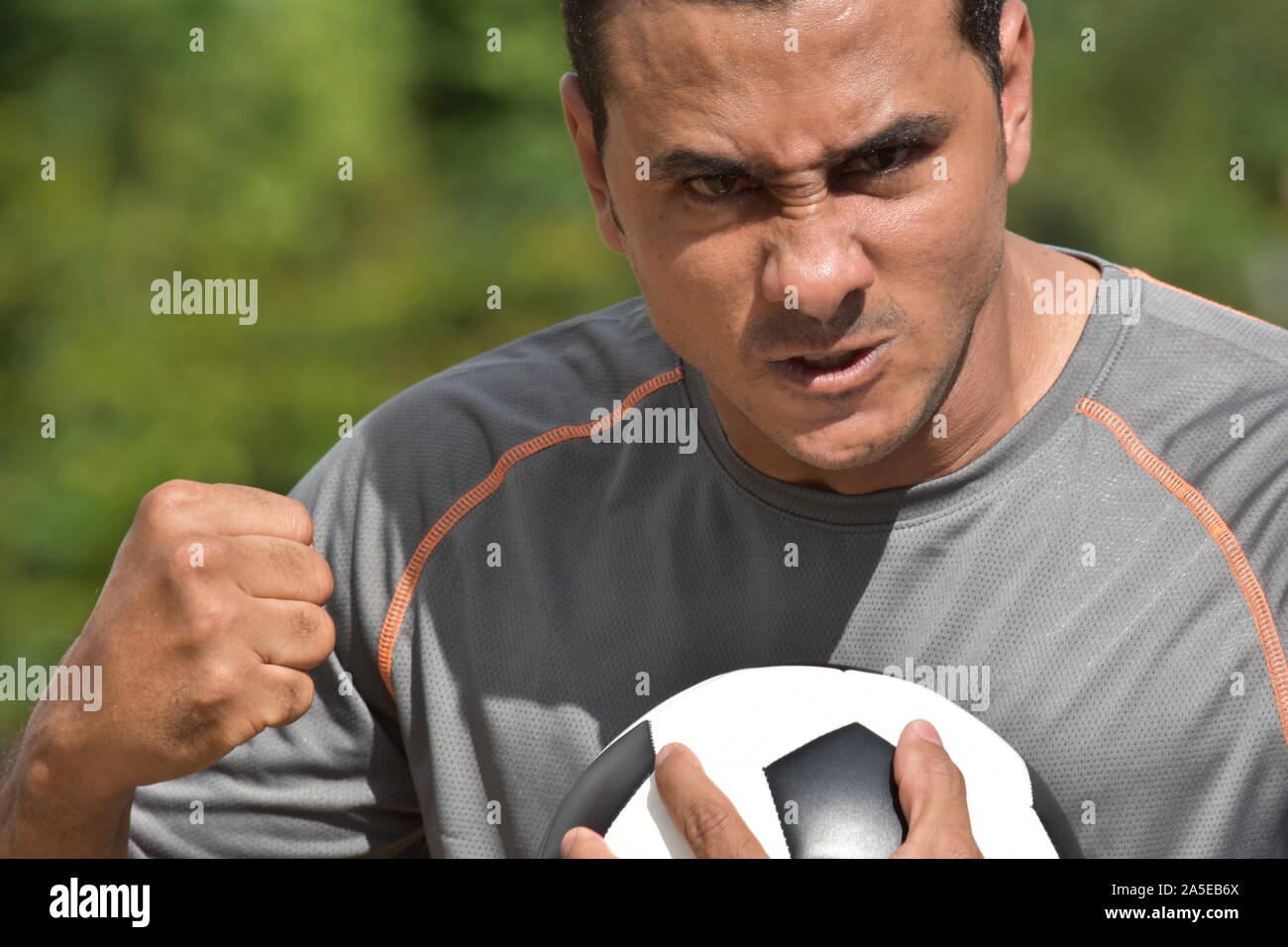 An Angry Adult Male Soccer Player Stock Photo - Alamy