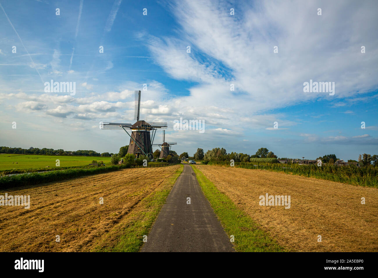 european dutch old windmill landscape with blue sky above Stock Photo ...