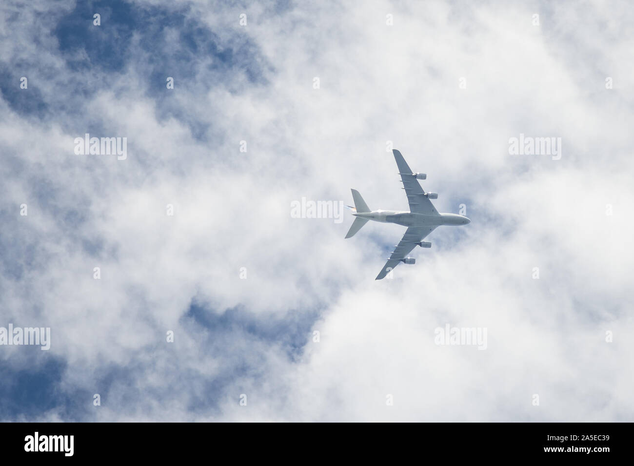 Large four-bladed aircraft, just captured from below. Scene near ...