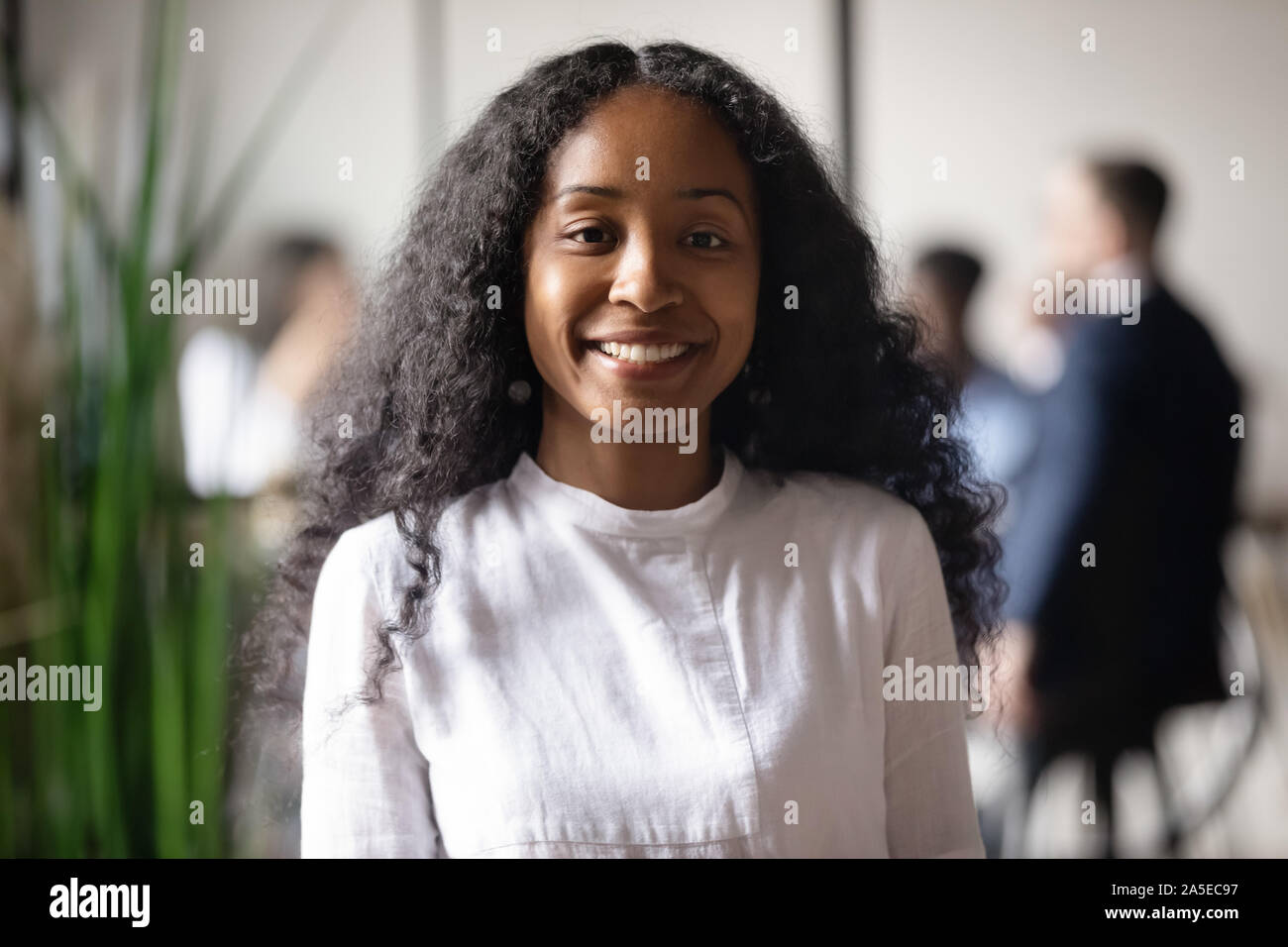 Closeup of young black woman looking into camera hi-res stock ...
