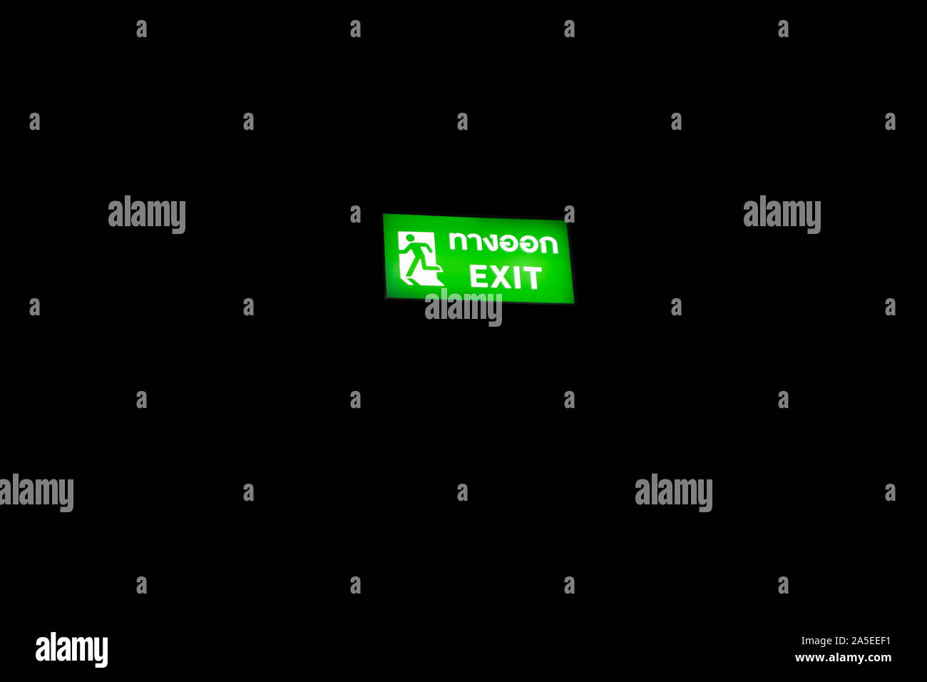 A Occupational Safety and Health Signs with dark background. Thai and ...