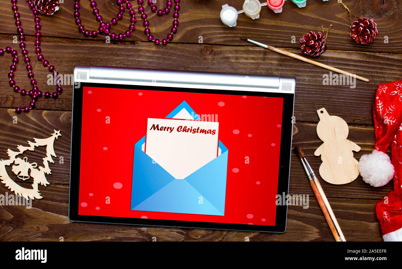 Merry Christmas, received an email on the tablet. Christmas background ...