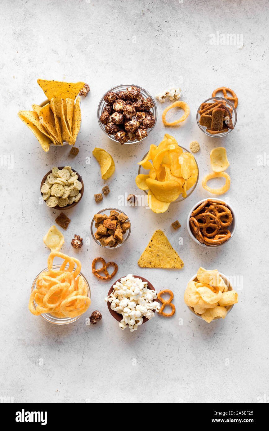 Set of Unhealthy Snacks: chips, popcorn, nachos, pretzels, onion rings ...