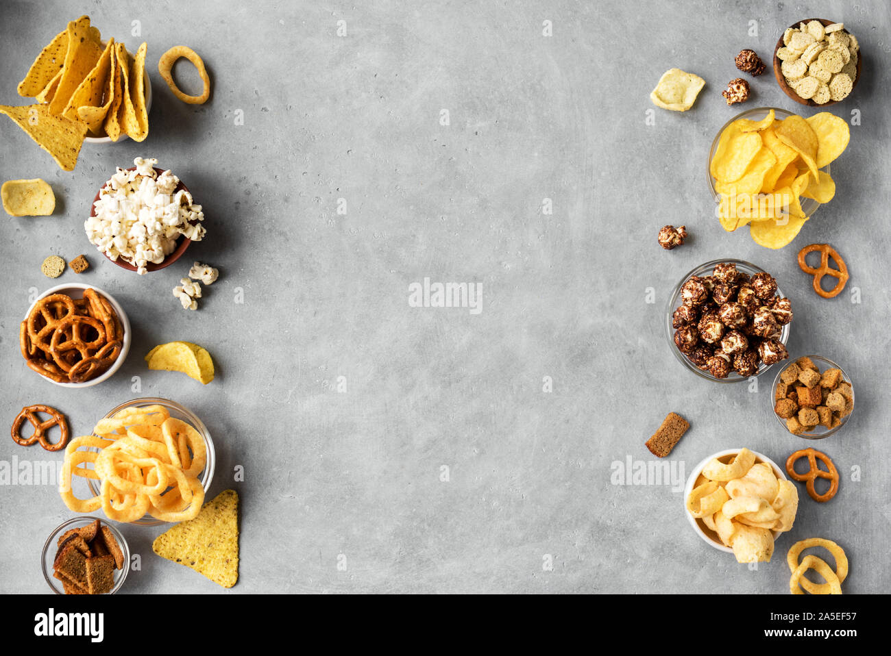 Set of Unhealthy Snacks: chips, popcorn, nachos, pretzels, onion rings ...