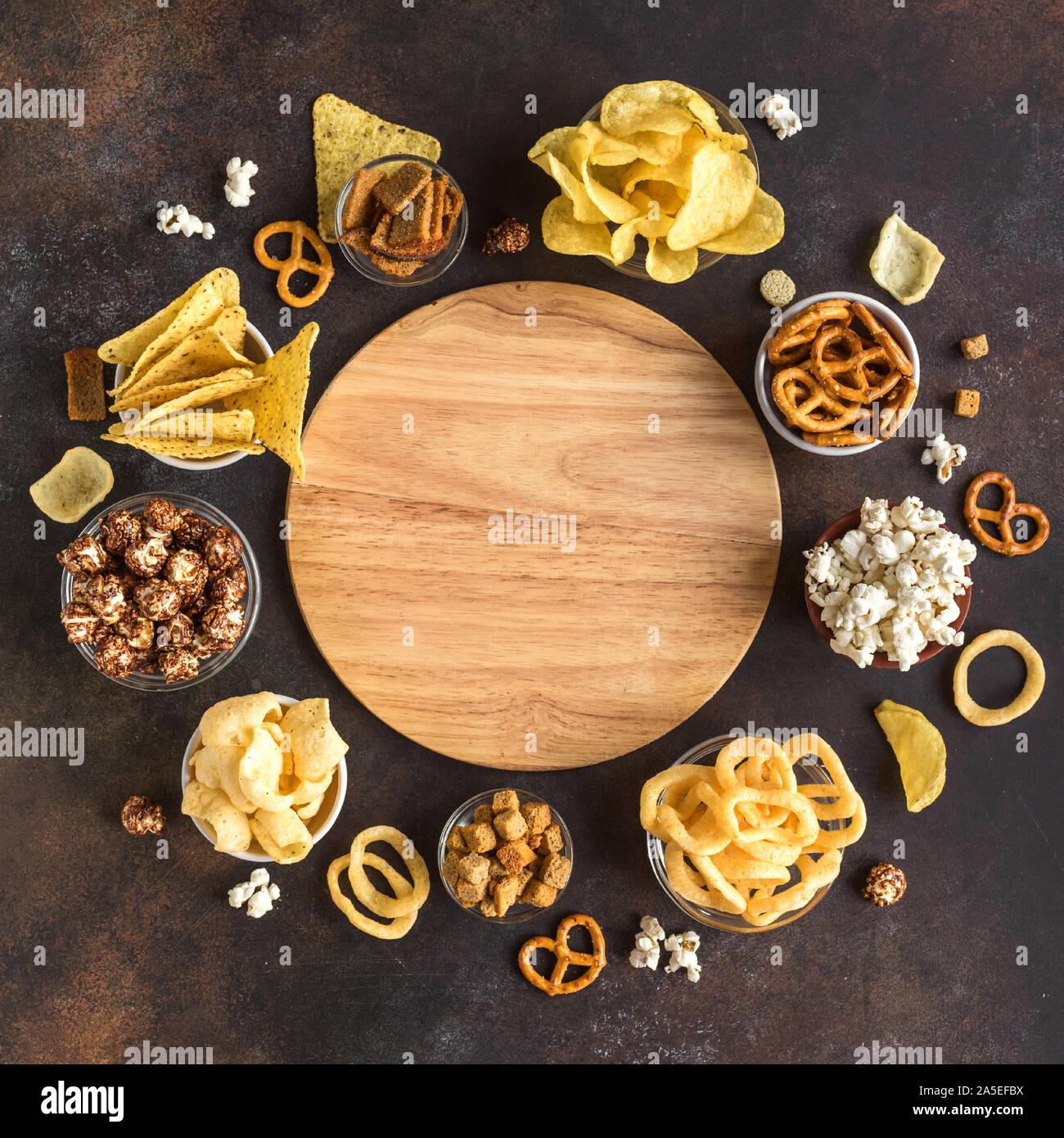 Set of Unhealthy Snacks: chips, popcorn, nachos, pretzels, onion rings ...