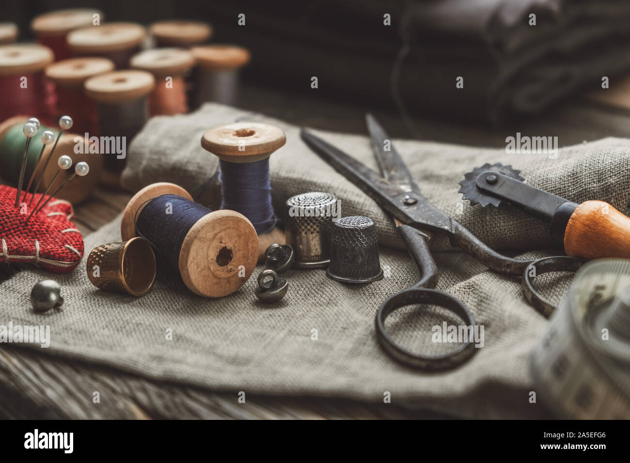 Vintage sewing items: retro tailoring scissors, measuring tape, thimble ...