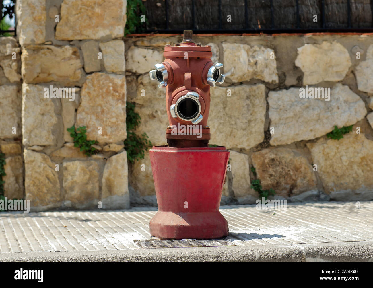 Old red fire hydrant on the street, looks like a face, funny face Stock ...