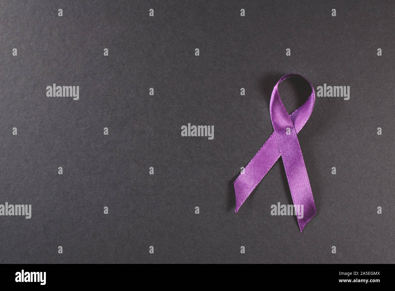 Purple ribbon on black background. Symbol of EPILEPSY awareness Stock ...