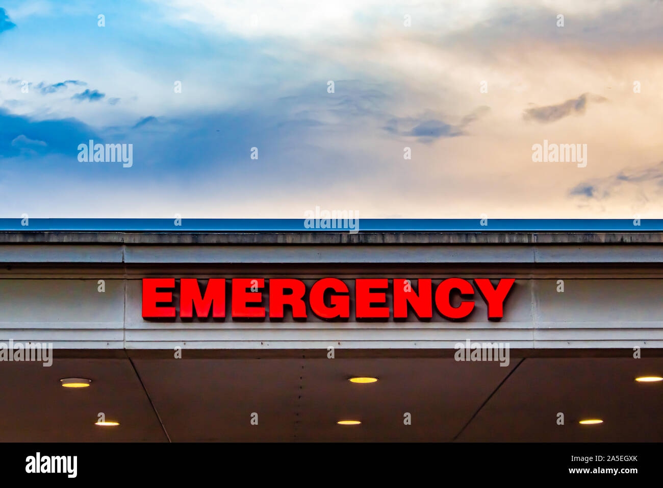 The sign in lit block lettering on the overhang above a drop-off ...