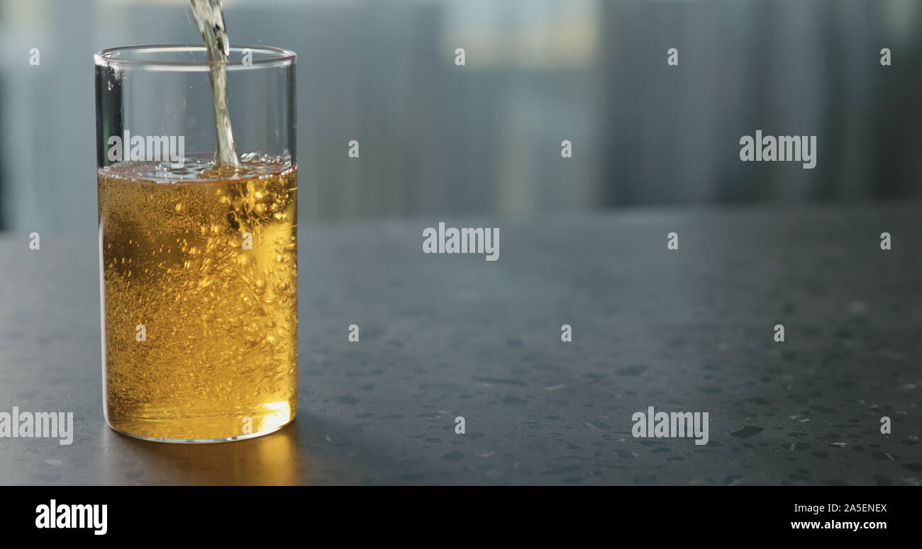 Pear cider pouring glass hi-res stock photography and images - Alamy