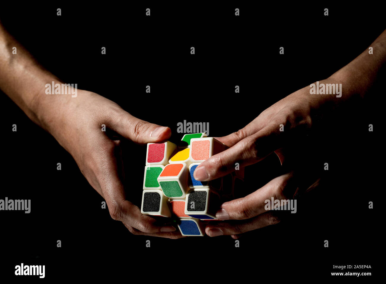Man with rubik cube hi-res stock photography and images - Alamy