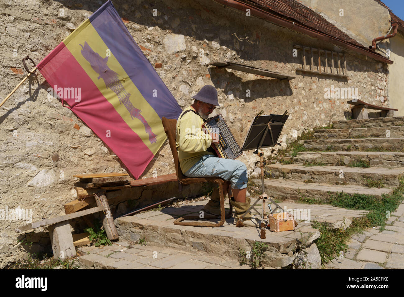Images caught inside the medieval fortress of Rasnov. Local man singing ...