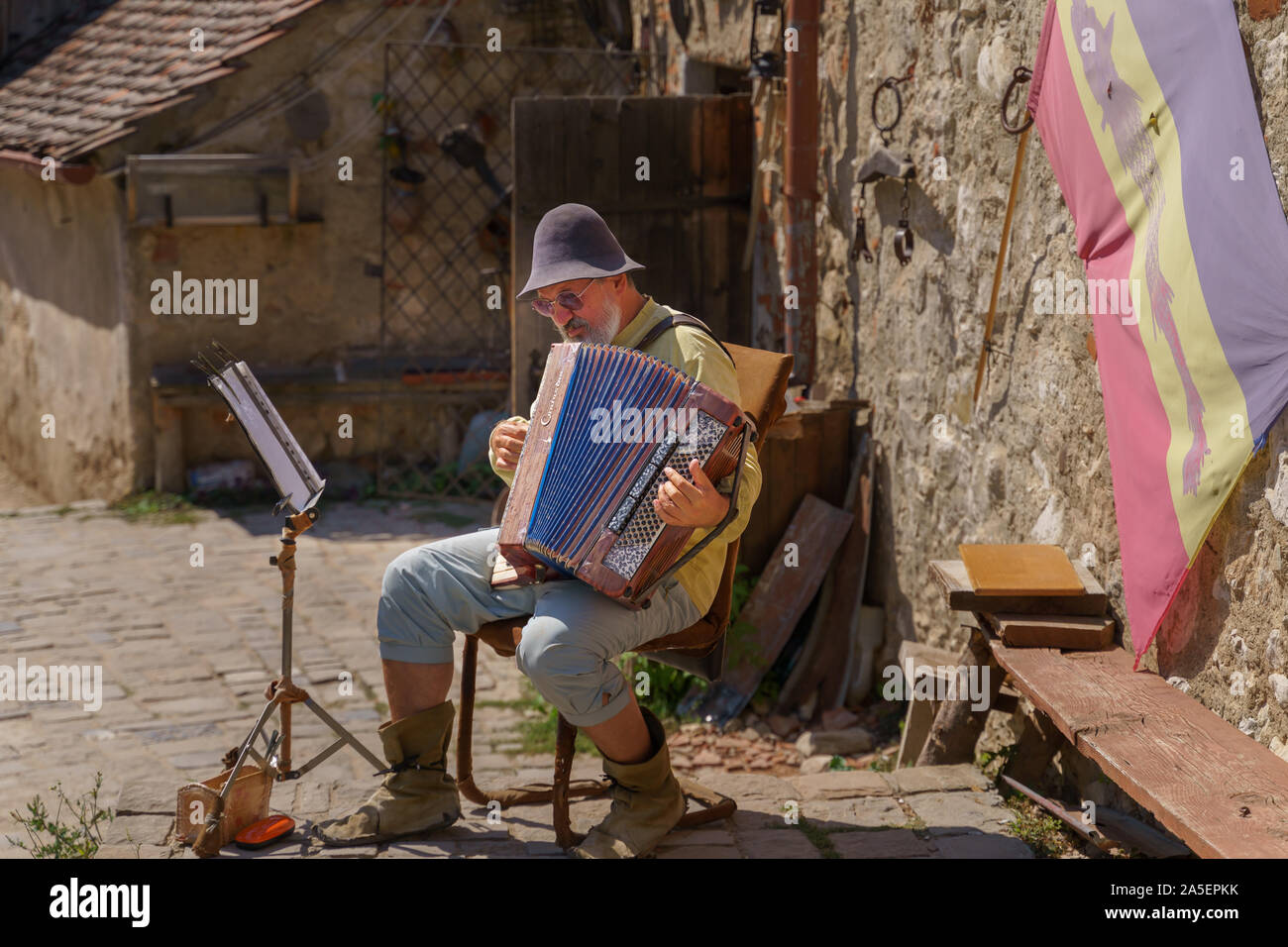 Images caught inside the medieval fortress of Rasnov. Local man singing ...