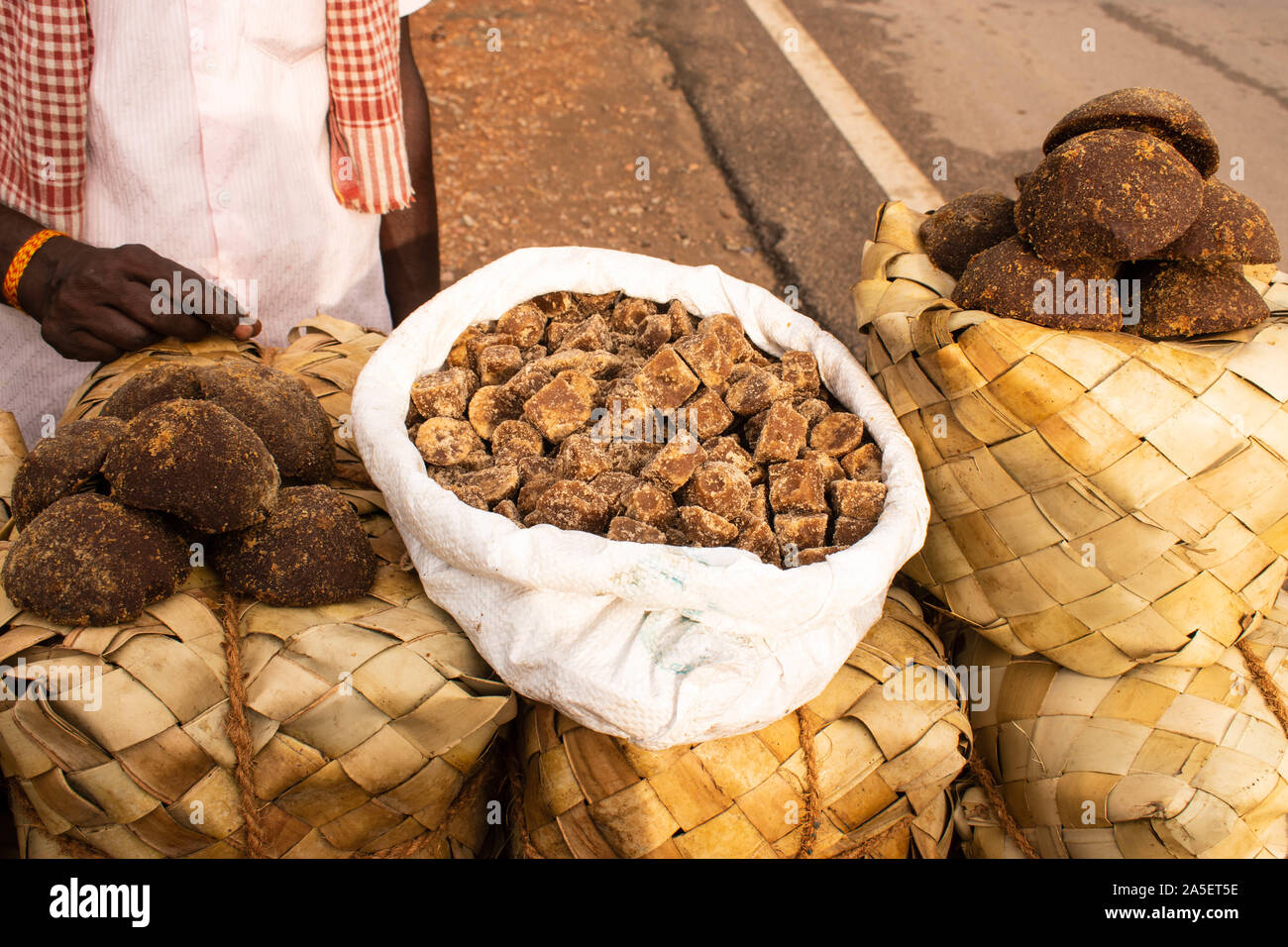 Man selling Jaggery Stock Photo - Alamy