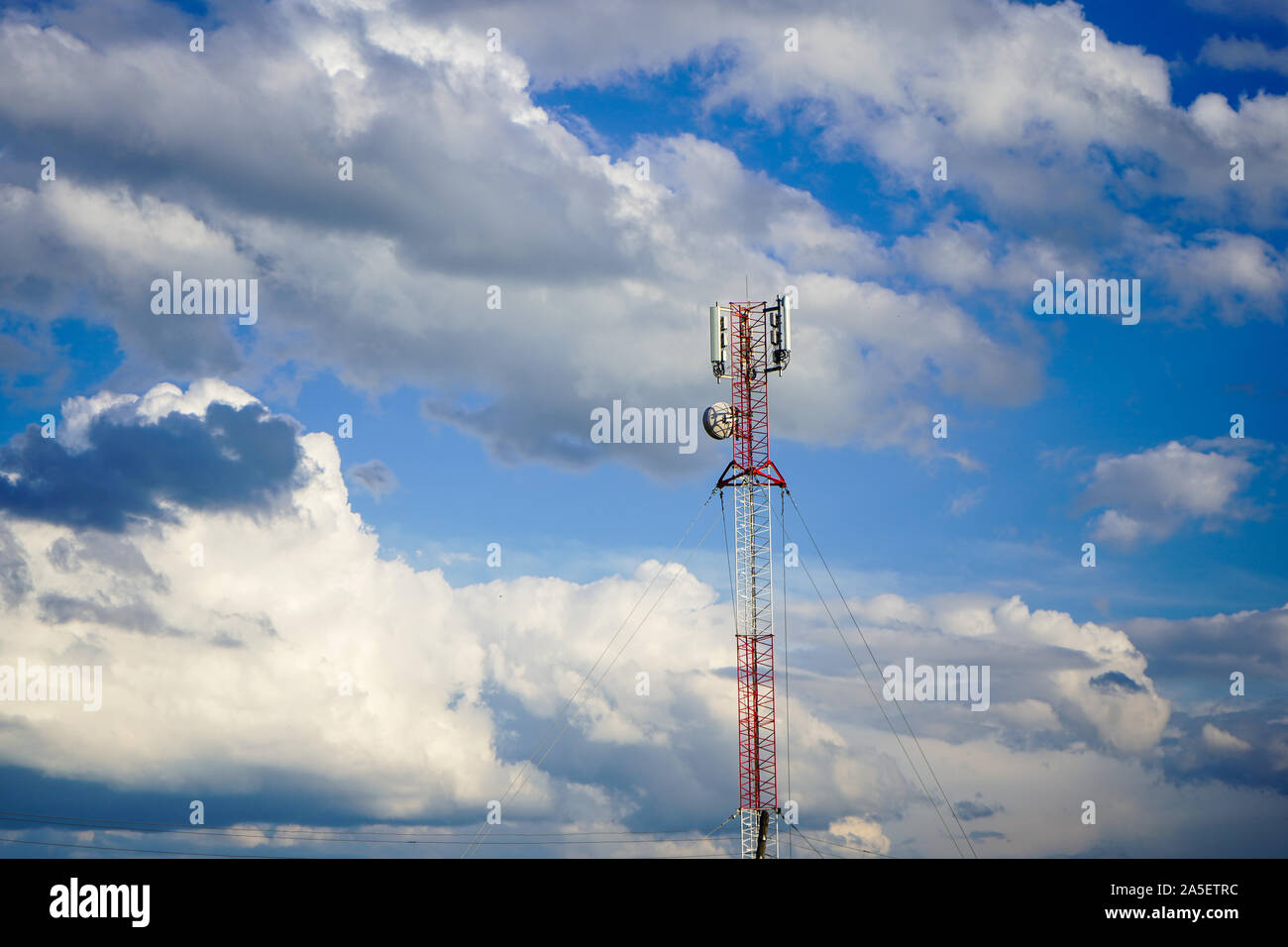 Cell tower on the background of beautiful clouds Stock Photo - Alamy