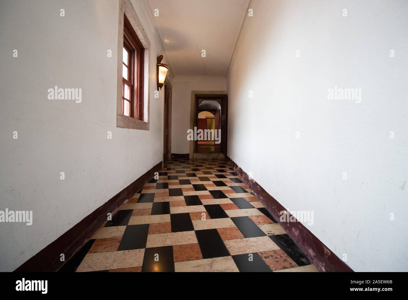 A long vintage corridor, indoors Stock Photo - Alamy