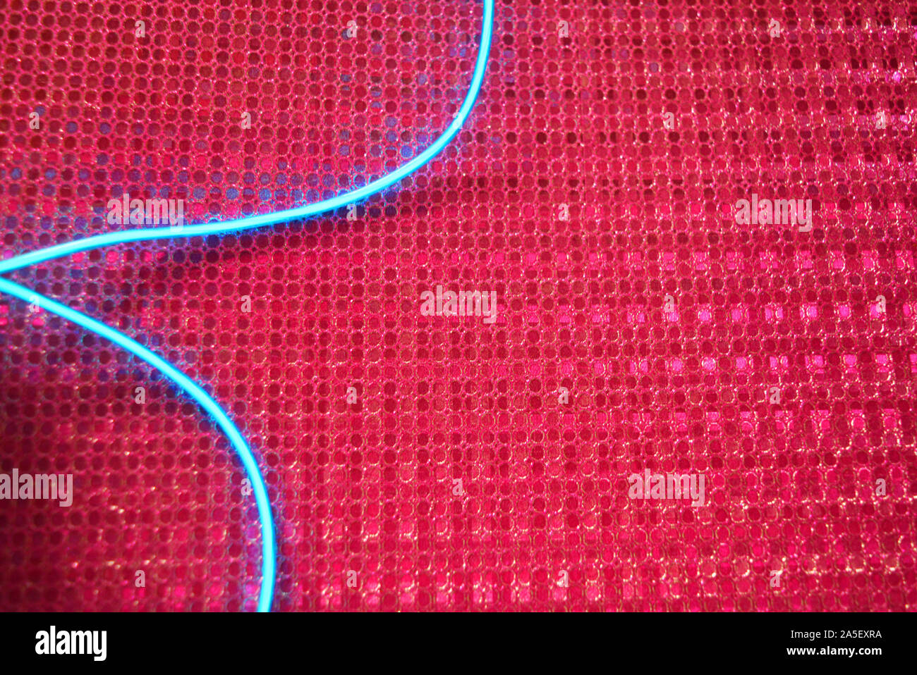 Blue glowing wire, cold neon, electroluminescent cord, cable lies on a ...