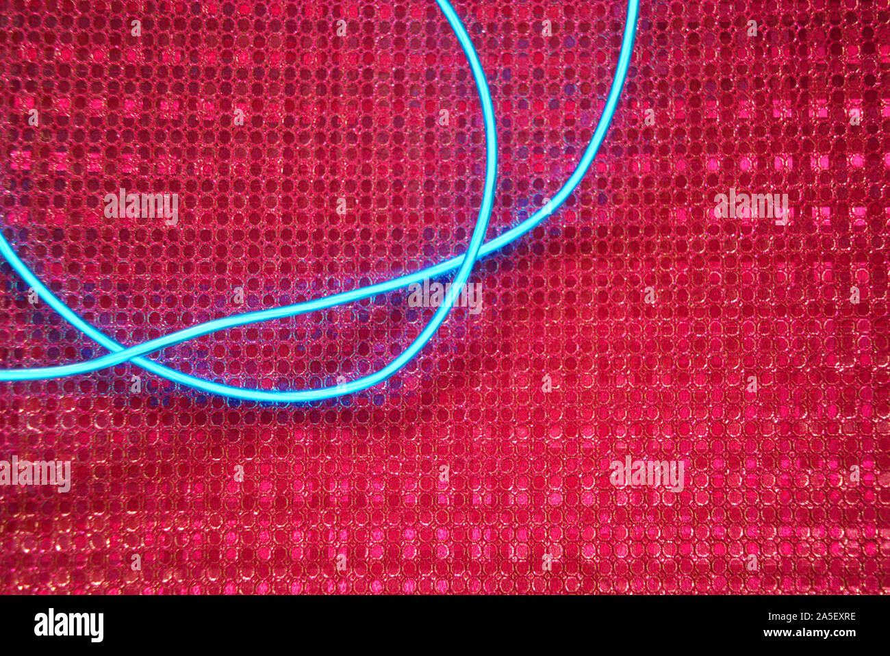 Blue glowing wire, cold neon, electroluminescent cord, cable lies on a ...