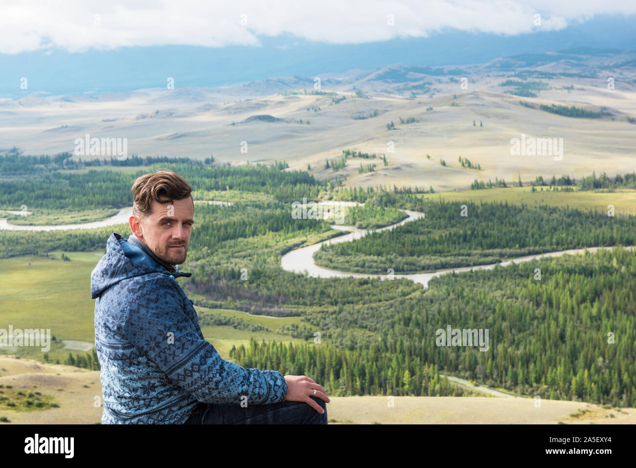 Relaxing man in Kurai steppe on North-Chui ridge Stock Photo - Alamy