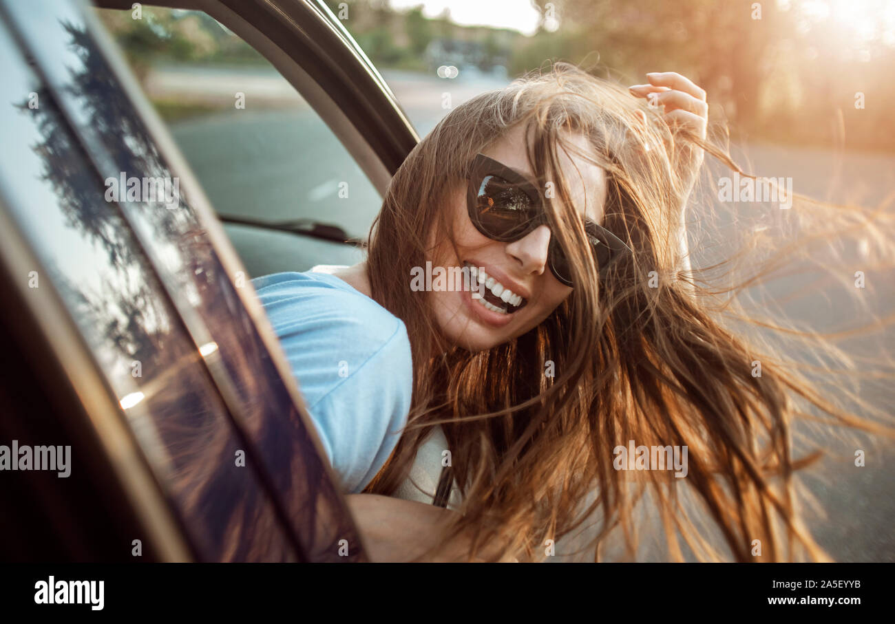 Passenger girl's magnificent hair fluttering as she leans out of the ...