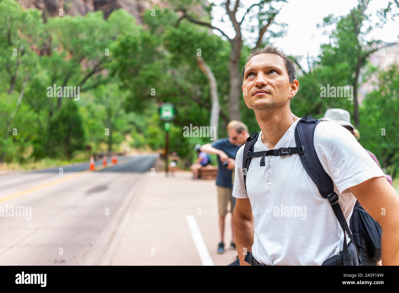 Zion National Park parking lot stop 7 on road in Utah with man waiting ...