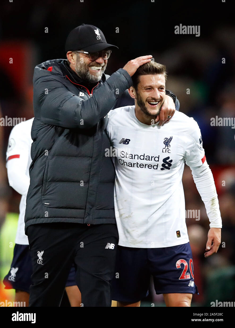 Liverpool manager Jurgen Klopp (left) celebrates with Adam Lallana ...