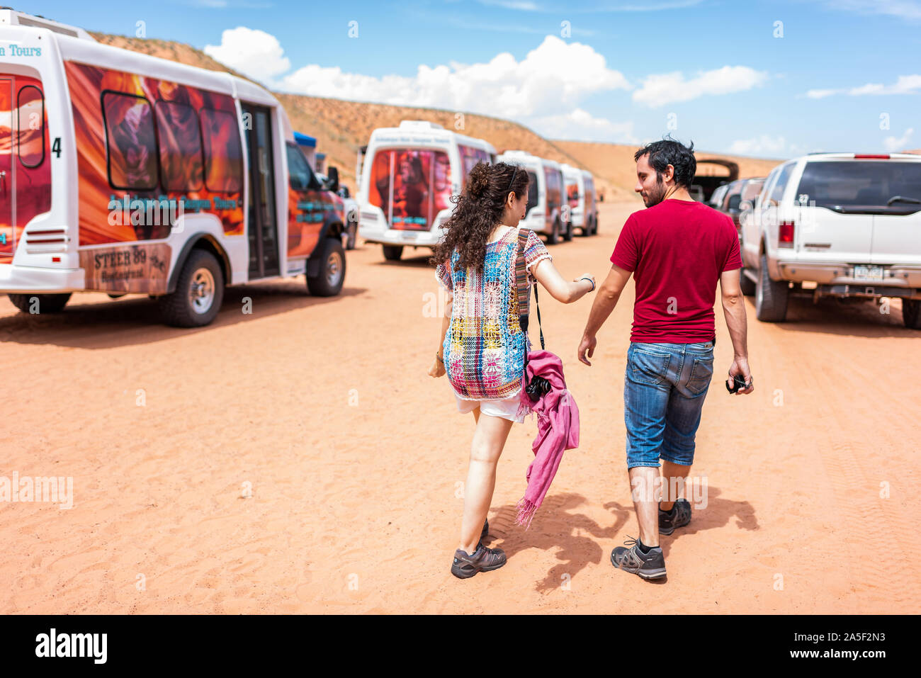 Page, USA - August 10, 2019: Tourist young couple walking by shuttle ...