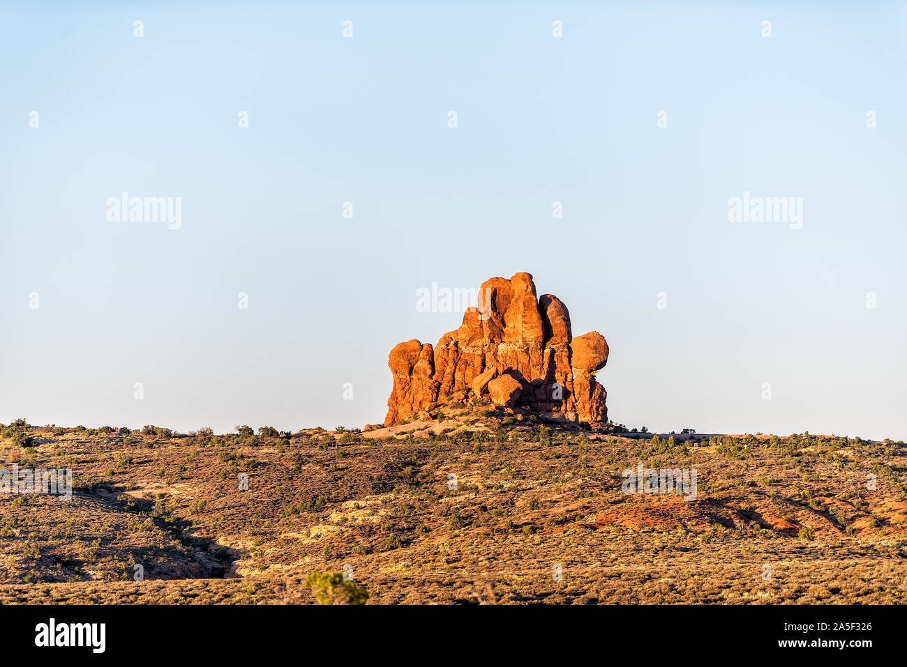 Balanced rock in Arches National Park butte far distant view on horizon ...